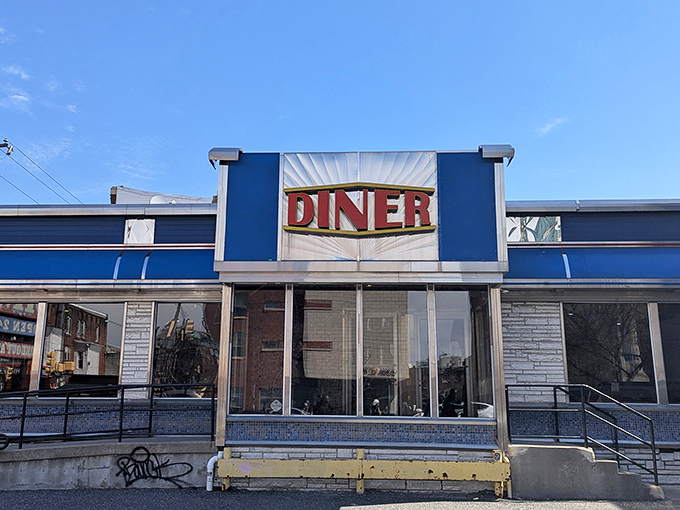 The iconic blue and silver facade of Broad Street Diner stands like a time capsule of Americana, beckoning hungry travelers with its classic neon promise.