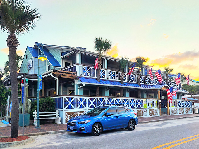 The seafoam-green charm of Flagler Tavern beckons from Flagler Avenue, its wraparound porches promising cold drinks and ocean breezes just steps from the Atlantic.