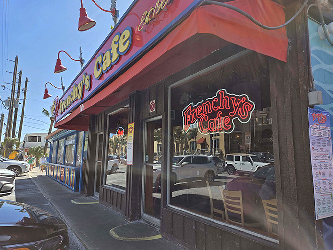 Frenchy's iconic exterior beckons seafood lovers with its vibrant red awning and unmistakable grouper mural &ndash; the Florida equivalent of a lighthouse for hungry sailors.