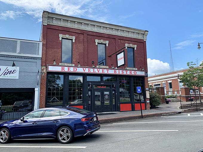 The historic brick fa&ccedil;ade of Red Velvet Bistro beckons hungry travelers with its classic charm and promise of Southern comfort within.