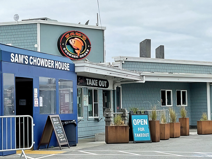 The iconic blue-shingled exterior with that glowing red crab sign&mdash;like a lighthouse guiding hungry seafood lovers home.