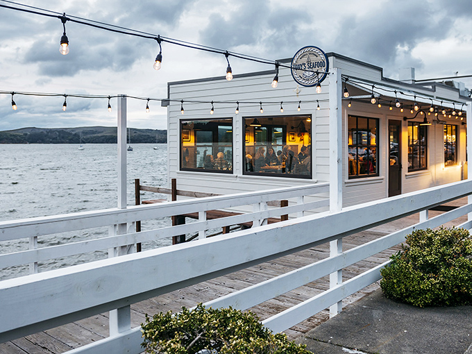 Floating above Tomales Bay like a delicious mirage, Tony's white exterior and string lights beckon hungry travelers to pause their coastal journey.