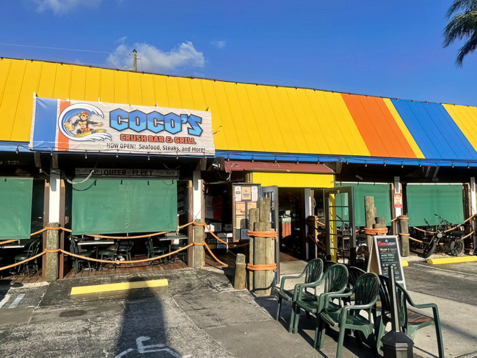 The sunshine-yellow exterior of Coco's isn't just a building&mdash;it's a mood announcement. Florida casual meets Maryland seafood tradition under those blue Surfpind umbrellas.