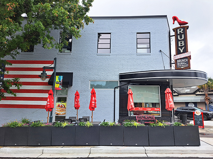 The sleek, modern entrance to Ruby Sunshine beckons like a breakfast lighthouse, promising morning salvation with its distinctive curved architecture.