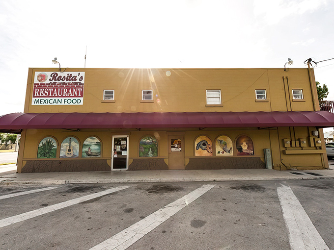 The sunshine-yellow exterior with its pink awning and vibrant murals isn't just inviting—it's practically shouting "authentic Mexican food happens here!"