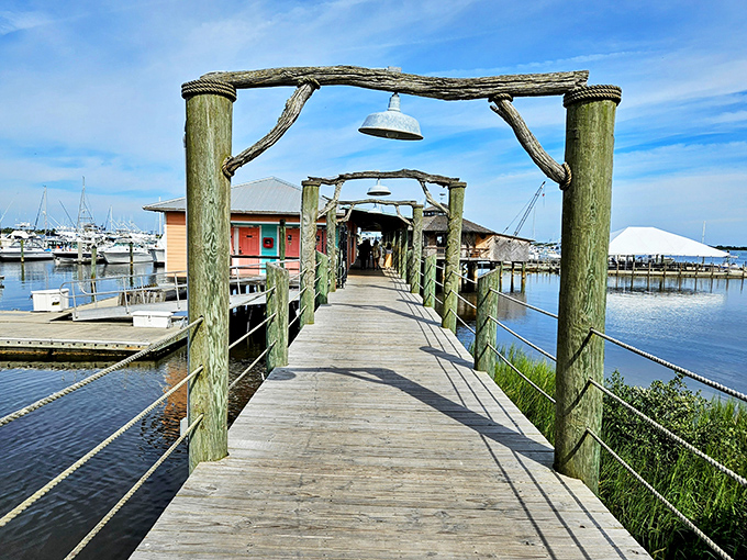 The entrance to paradise isn't pearly gates&mdash;it's a weathered boardwalk beneath a marlin sign, promising Caribbean flavors just steps away.