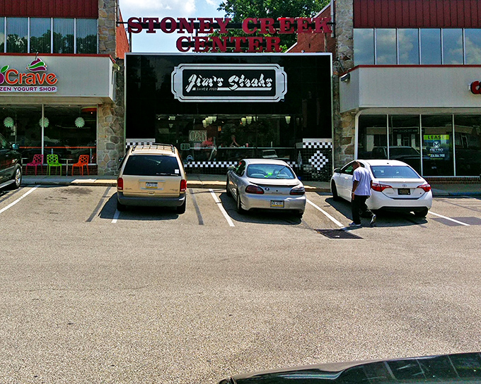 Jim's Steaks welcomes hungry visitors with its classic storefront in Stoney Creek Center. The checkered trim hints at the culinary treasures waiting inside.