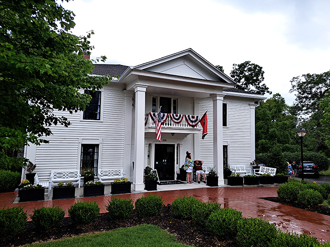 The grand white facade of Miss Mary Bobo's stands like a Southern belle waiting to welcome you home. Those rocking chairs aren't just for show!