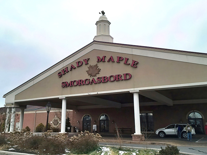 The grand entrance to Shady Maple Smorgasbord stands like a temple to abundance, promising culinary salvation to all who enter its hallowed doors. 
