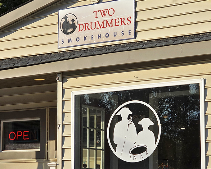 The yellow facade of Two Drummers Smokehouse welcomes hungry travelers like a beacon of barbecue hope on Virginia's culinary landscape.