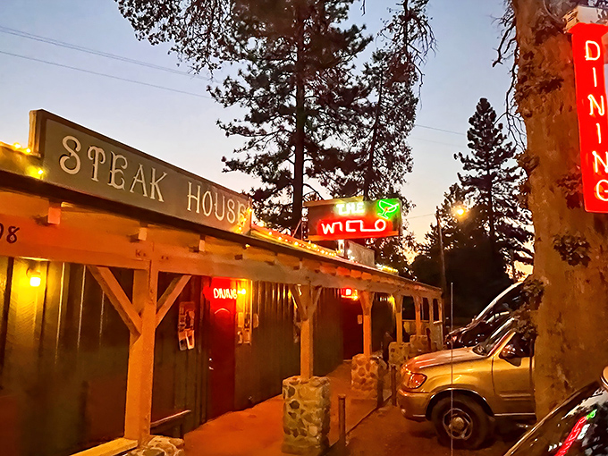 The neon glow of Willo's sign against the twilight sky is like a beacon for hungry travelers. Pure roadside Americana that promises carnivorous delights within.