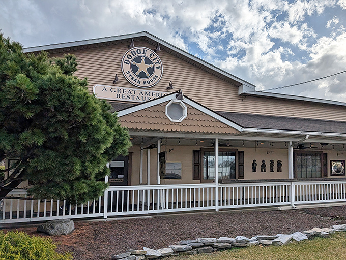 The Western-inspired exterior of Dodge City Steakhouse welcomes hungry travelers with its rustic charm and promise of carnivorous delights ahead.