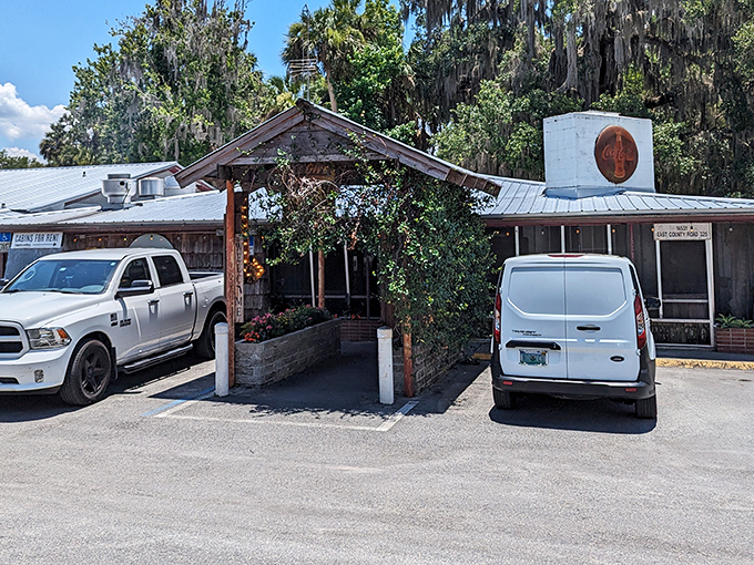 The unassuming exterior of The Yearling, complete with vintage Coca-Cola sign and that whimsical metal moon sculpture, promises authentic Florida without the tourist brochure gloss.