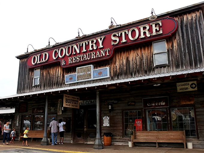 The weathered wooden exterior of Brooks Shaw's Old Country Store beckons like a time machine disguised as a restaurant. Southern comfort awaits inside! 