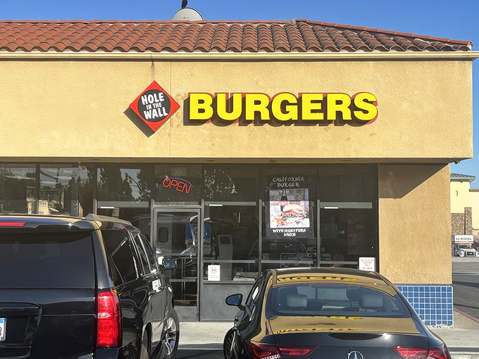 The unassuming storefront that launched a thousand cravings. Like Clark Kent's phone booth, this beige exterior hides superhero-level burgers inside.