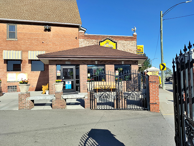 The unassuming exterior of Taqueria Mi Pueblo might not scream "culinary revelation," but that yellow sign is basically a beacon for flavor-seekers in Detroit's Mexicantown.
