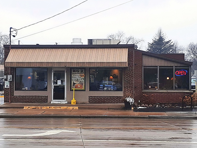 The corner brick building with its vintage "GRILLED HAM SANDWICH" sign stands like a breakfast lighthouse guiding hungry souls through Appleton's morning fog.