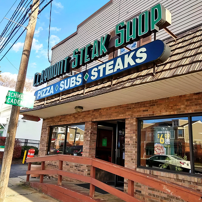 The unassuming exterior of Claymont Steak Shop stands like a culinary lighthouse, beckoning sandwich pilgrims from miles around with its no-nonsense charm.
