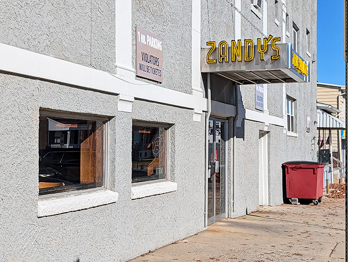 The unassuming gray exterior of Zandy's Steak Shop stands like a culinary fortress, promising treasures within that no flashy facade could ever match.