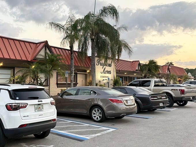The unassuming exterior of Tropical Acres Steakhouse proves that in Florida, the best culinary treasures often hide behind modest facades and swaying palm trees.