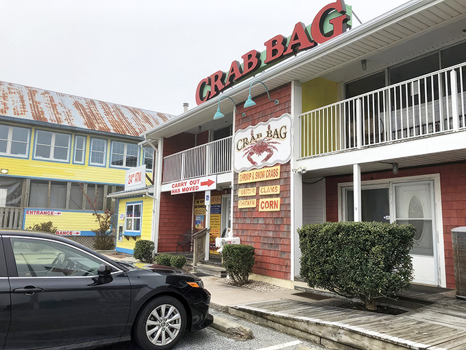 The colorful exterior of Crab Bag stands like a seafood beacon on Ocean City's Coastal Highway, promising treasures of the Chesapeake within.