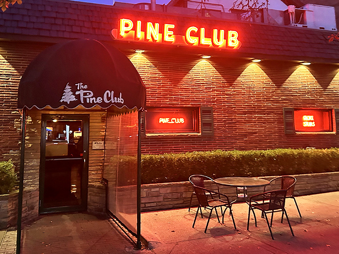 The neon glow of The Pine Club sign has been beckoning hungry Daytonians for decades, a red-lit promise of carnivorous delights within.