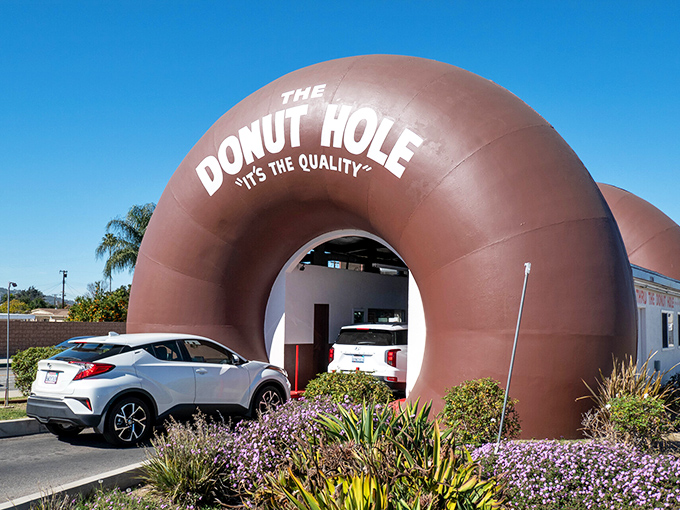 Architectural whimsy meets breakfast brilliance at The Donut Hole in La Puente, where your car literally drives through a giant donut. Only in California!