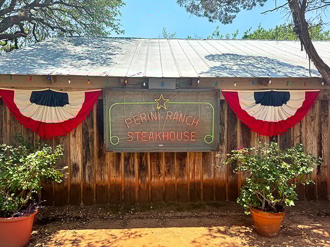 The unassuming exterior of Perini Ranch Steakhouse proves once again that in Texas, the most spectacular food often hides behind the most modest facades.