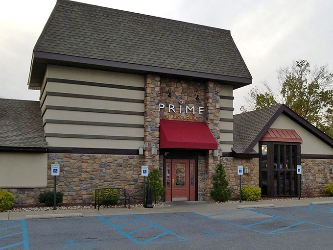 The stone facade of Prime Steak House welcomes hungry travelers with its distinctive red awning&mdash;like a beacon of culinary promise in Bethlehem's dining landscape.