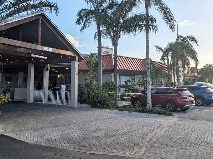 The unassuming exterior of Tropical Acres Steakhouse proves that in Florida, the best culinary treasures often hide behind modest facades and swaying palm trees.