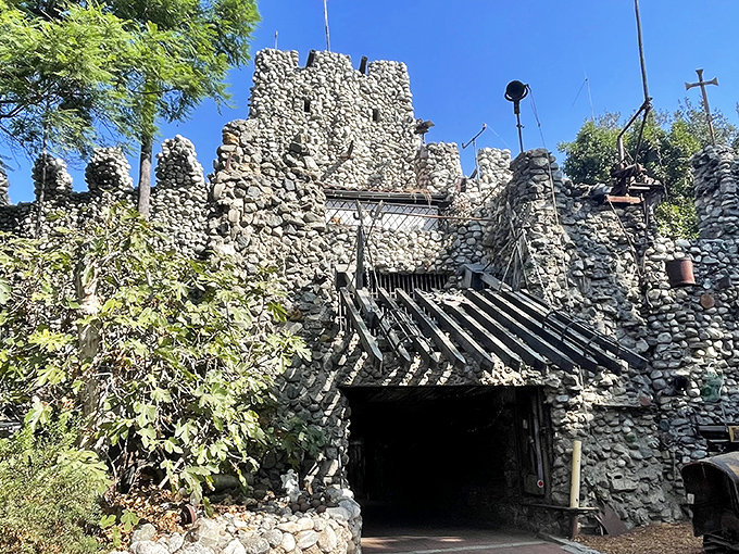 Stone by stone, a fantasy rises from suburban reality. Rubel Castle's imposing entrance looks like it teleported straight from medieval Europe to Southern California.