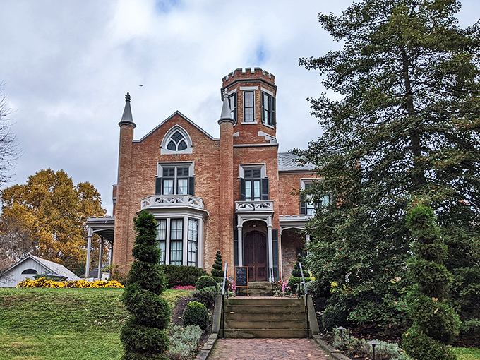 The Castle rises from Marietta like a Victorian dream, its brick turret and Gothic details whispering tales of a more elegant era.