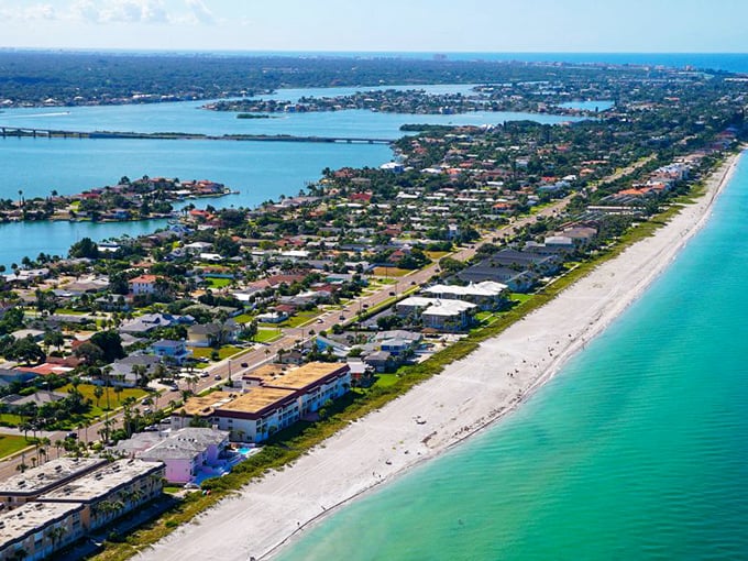 Morning light bathes the sky over Tarpon Springs' iconic lighthouse, where Greek heritage meets Florida charm in a postcard-perfect coastal scene.