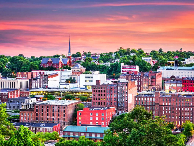 Lynchburg's skyline at sunset looks like someone spilled a box of vintage brick buildings beneath a cotton candy sky.
