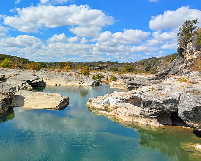 Nature's own infinity pool. The emerald waters of Pedernales Falls create a stunning contrast against ancient limestone that's been perfecting its pose for millions of years.