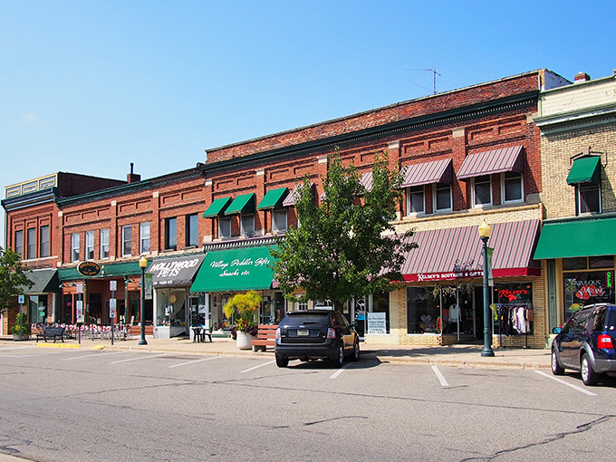 Classic brick storefronts line Brooklyn's charming main street, where racing excitement meets small-town serenity perfectly.