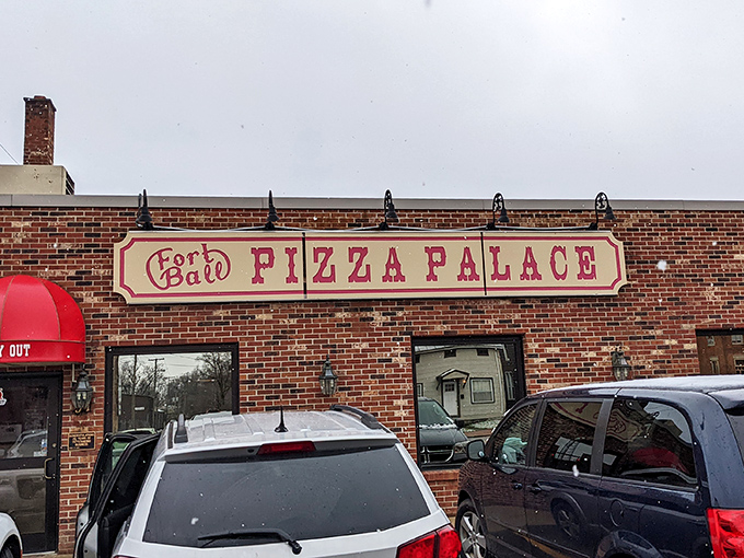 The brick fortress of flavor stands ready, promising pasta perfection behind that unassuming "Pizza Palace" sign.