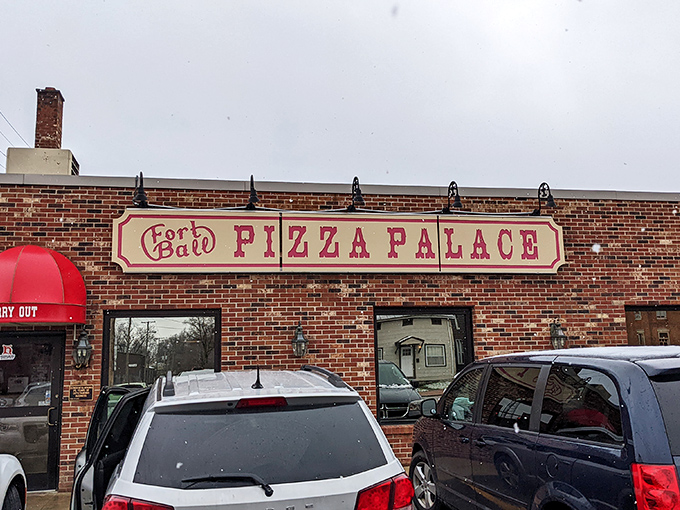 That classic brick facade hides culinary treasures that would make your Italian grandmother weep with joy.
