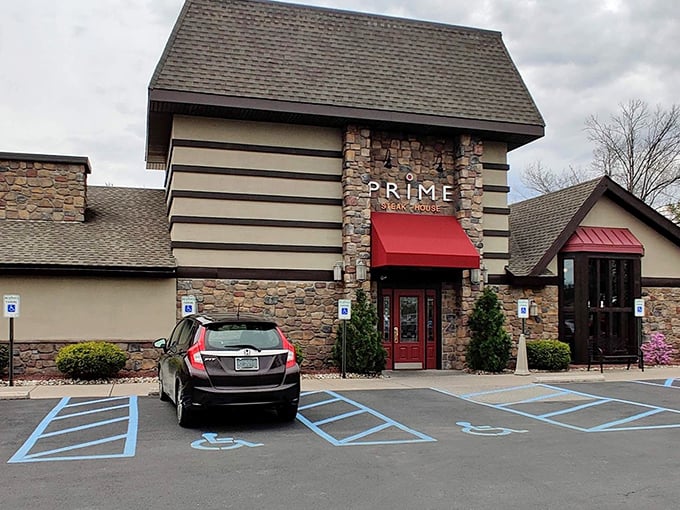 The stone facade of Prime Steak House welcomes hungry travelers with its distinctive red awning&mdash;like a beacon of culinary promise in Bethlehem's dining landscape.