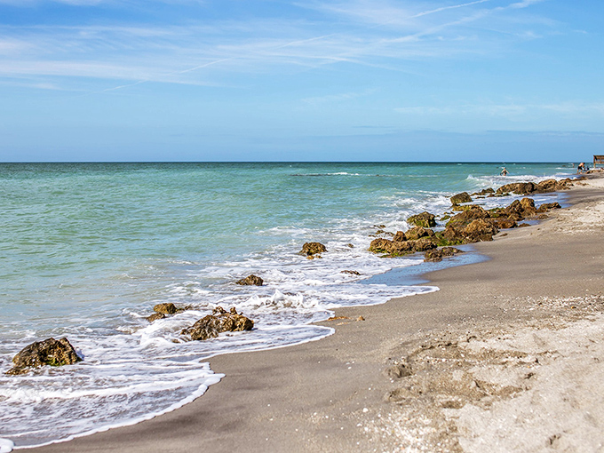 Mother Nature's watercolor masterpiece unfolds at Caspersen Beach, where turquoise waters meet pastel skies and time seems to stand perfectly still.
