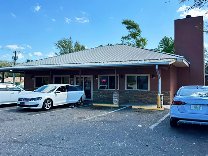 The unassuming pink building with its metal roof might not scream "barbecue paradise," but your nose will know better before you even park.