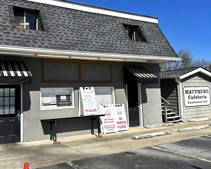 The unassuming storefront with its striped awning and rocking chairs whispers a promise that grandma-approved comfort food awaits inside.