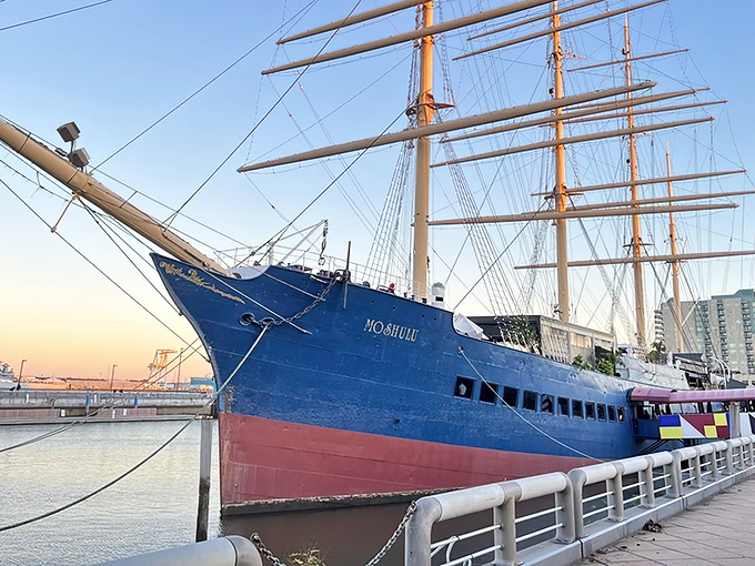 The mighty Moshulu in all her blue-hulled glory, standing sentinel at Penn's Landing like a maritime guardian that traded sailing the high seas for serving high cuisine.