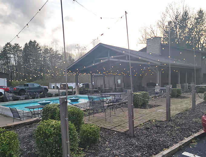 String lights twinkle above the patio at Black Iron Grille, creating that magical atmosphere where summer evenings stretch into memorable nights.