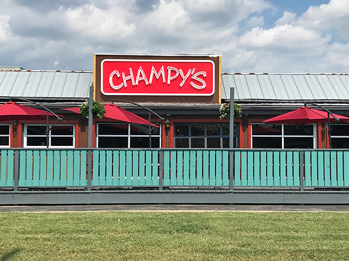 The glowing red Champy's sign beckons hungry travelers like a Southern food lighthouse guiding ships to delicious shores.
