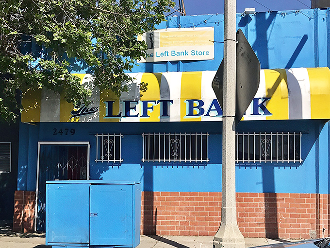 The unassuming green exterior with its jaunty striped awning conceals a treasure trove of fashion finds. It's like the speakeasy of thrift stores.