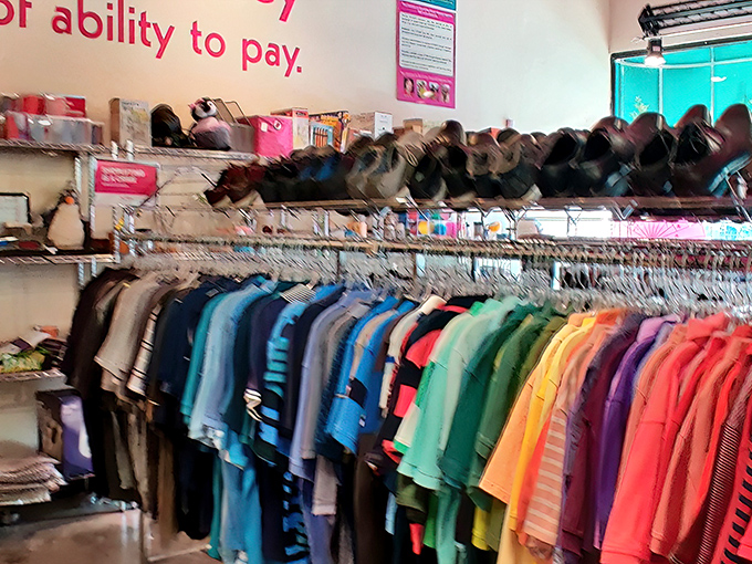 The signature hot pink ceiling welcomes you like a fabulous hug. Meticulously organized racks promise treasure hunting without the usual thrift store chaos.