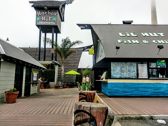 The iconic A-frame silhouette of Harbor Hut stands proudly against Morro Rock, like California's answer to a Hawaiian postcard come to life.