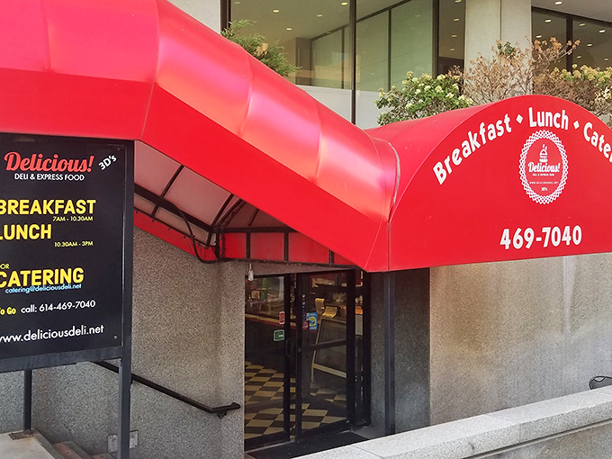 That red awning beckons like a beacon of breakfast bliss in downtown Columbus.