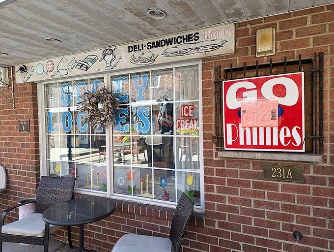 The unassuming brick fa&ccedil;ade of Gooey Looies might not scream "culinary destination," but that Phillies sign is practically whispering "authentic local treasure."